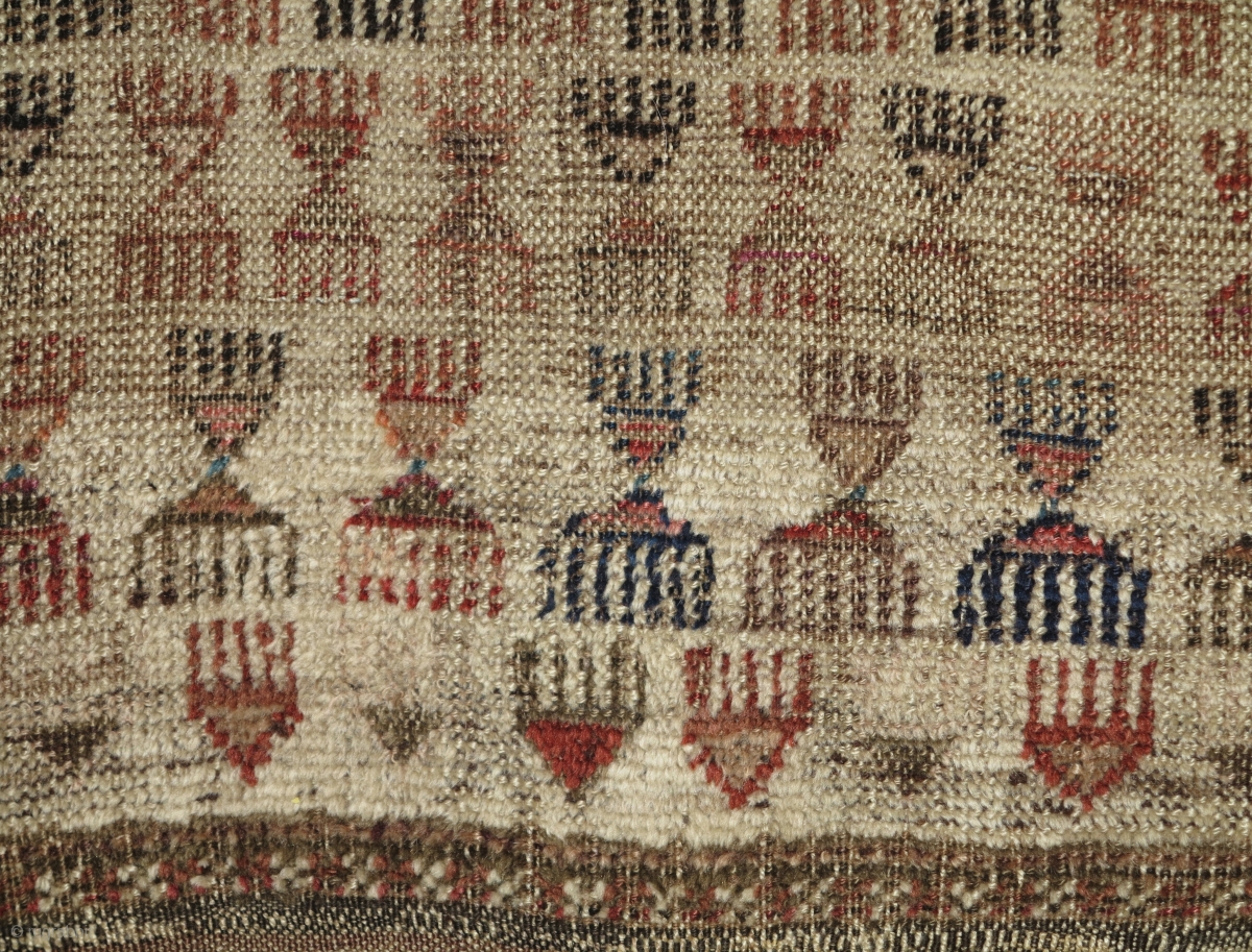 white-ground Baluch balisht with a repeat 'comb' design. A strange ...